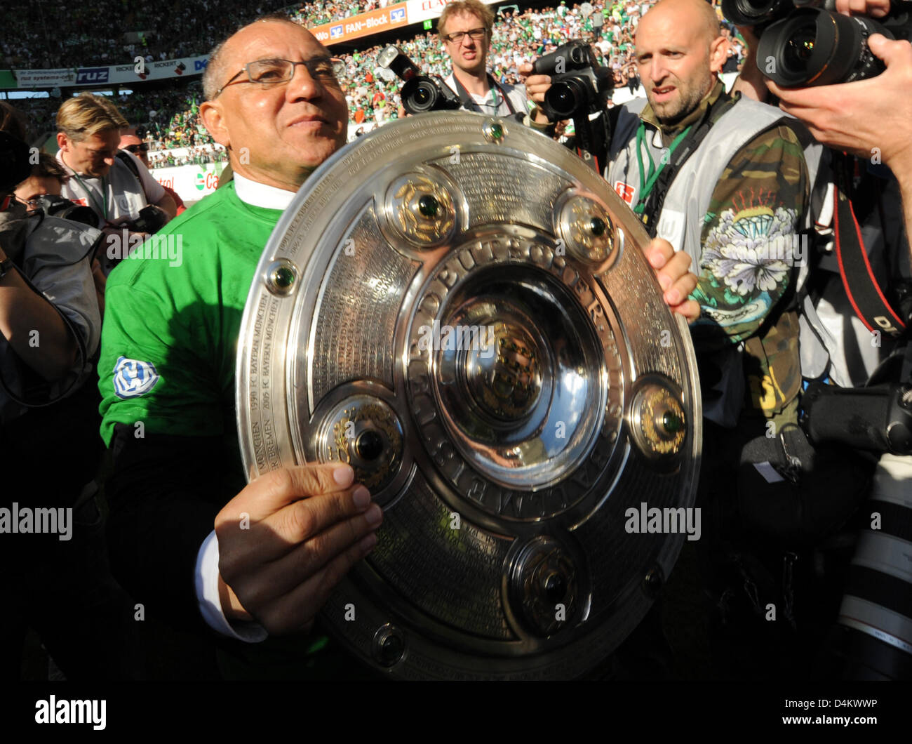 Wolfsburg?s head coach Felix Magath celebrates with the championship ...