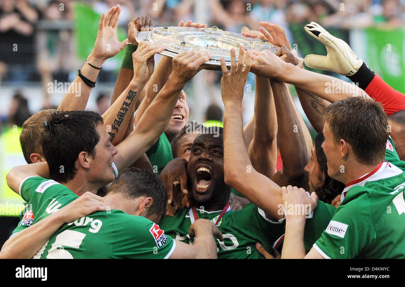 Wolfsburg?s players celebrate with the championship shield after the ...