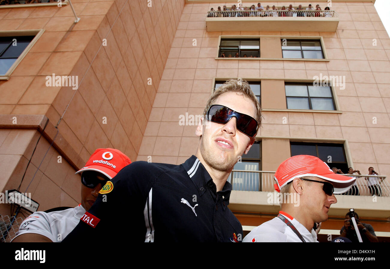 German Formula One driver Sebastian Vettel (C) of Red Bull and Finnish ...