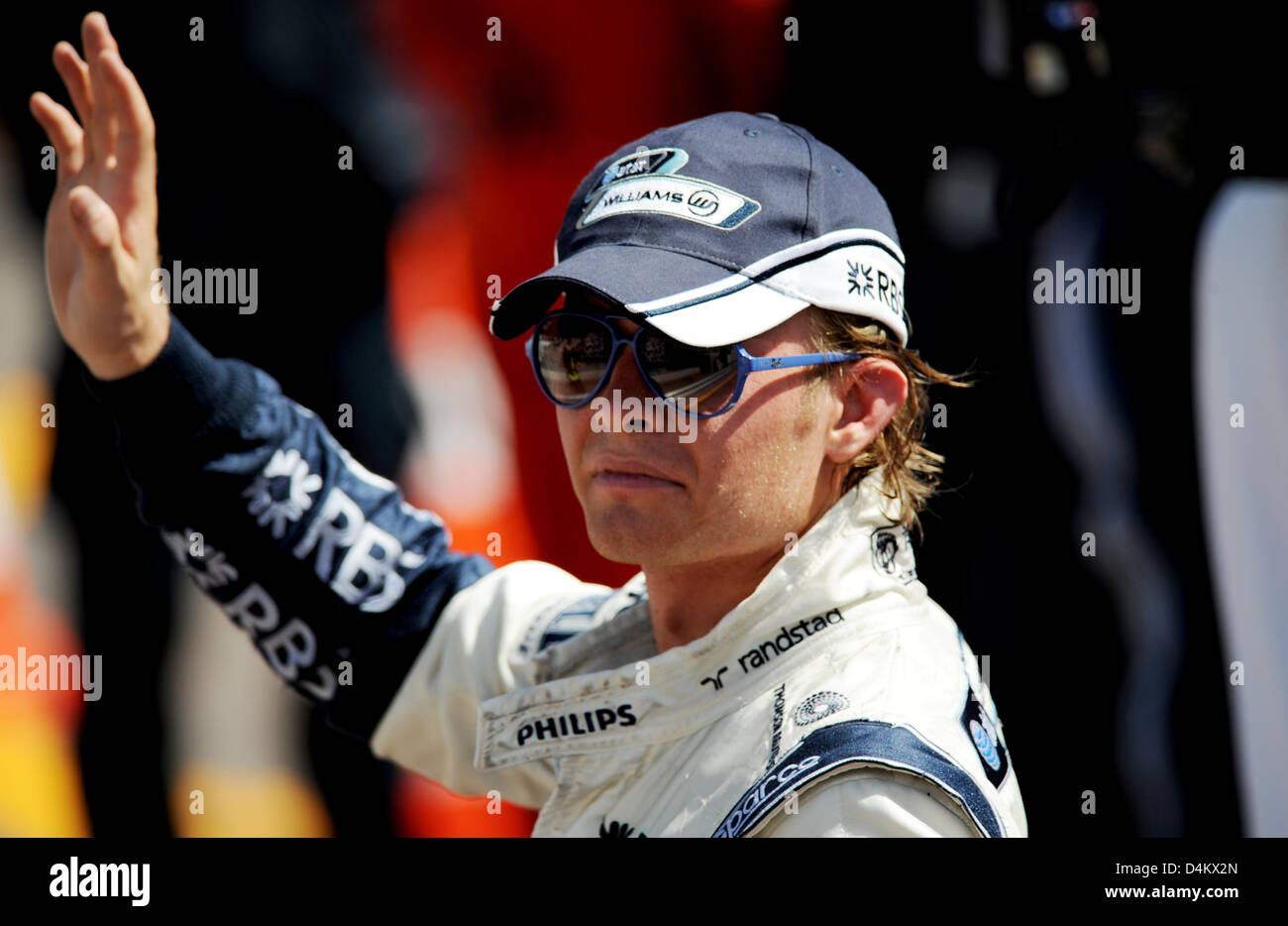 German Formula One driver Nico Rosberg waves to the spectators after ...