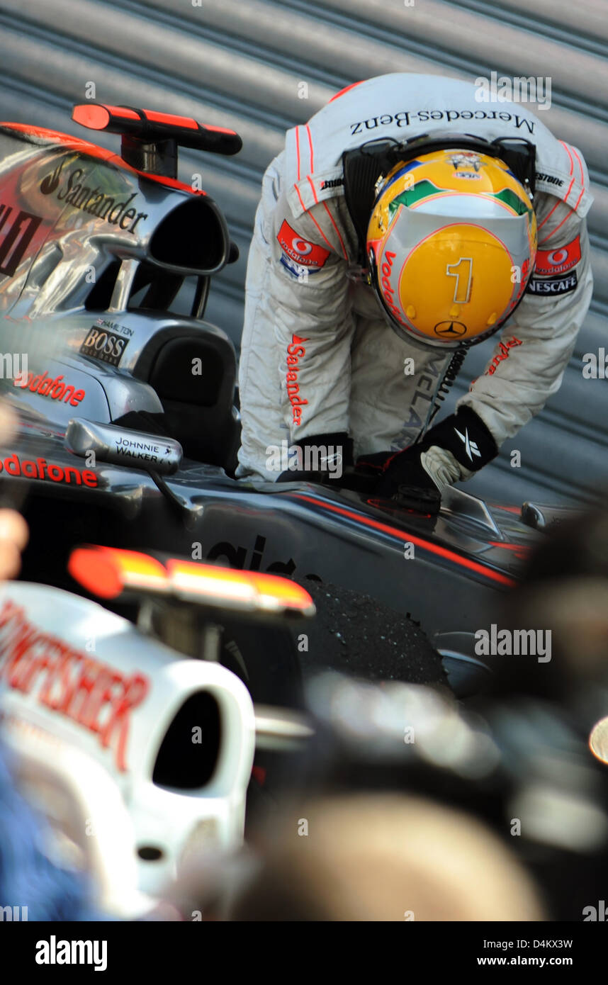 British Formula One driver Lewis Hamilton steps out of his car after ...