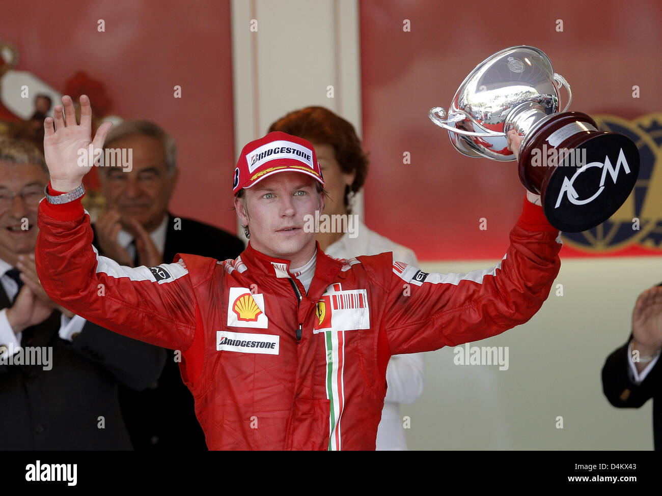 Third placed Finnish Formula One driver Kimi Raikkonen of Ferrari ...