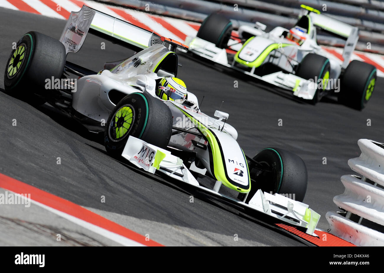 British Formula One driver Jenson Button (front) and Brazilian Formula ...