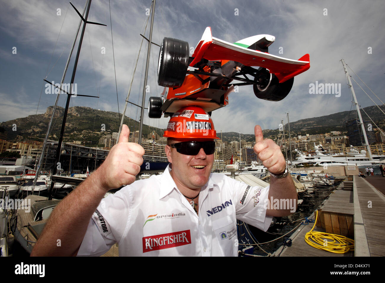 A man with a racing car on the head seen in the paddock for for the F1 ...