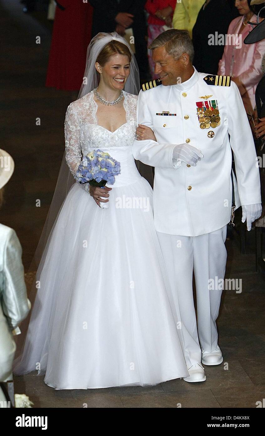 Bride Kelly Jeanne (nee Rondestvedt) is led to the altar by her father ...
