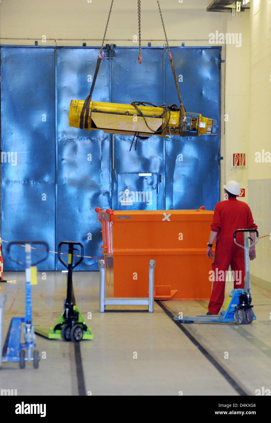 Worker dismantle machines in the turbine hall of the former atomic ...