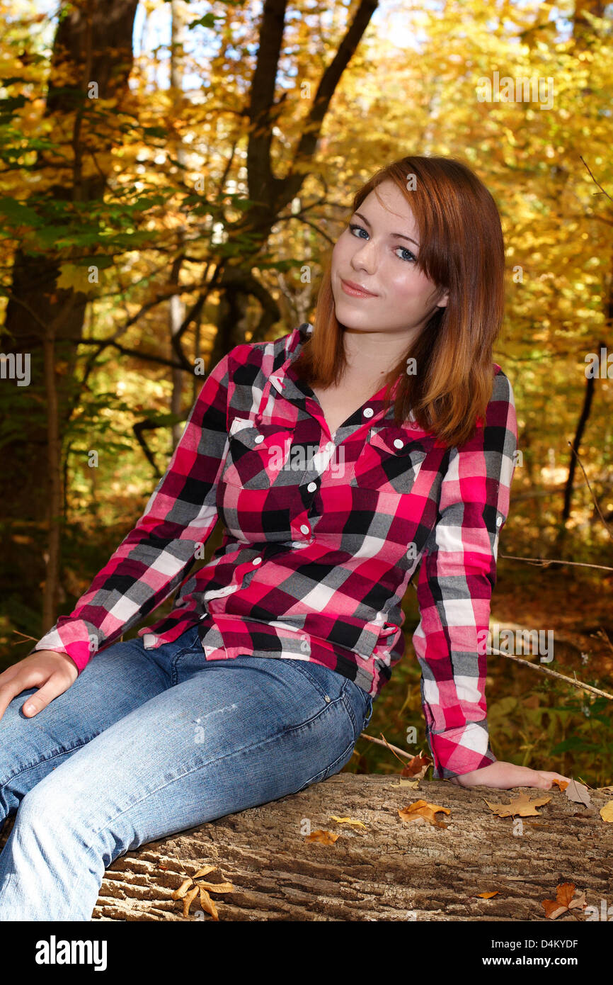 Teenage girl outdoors in flannel shirt Stock Photo - Alamy