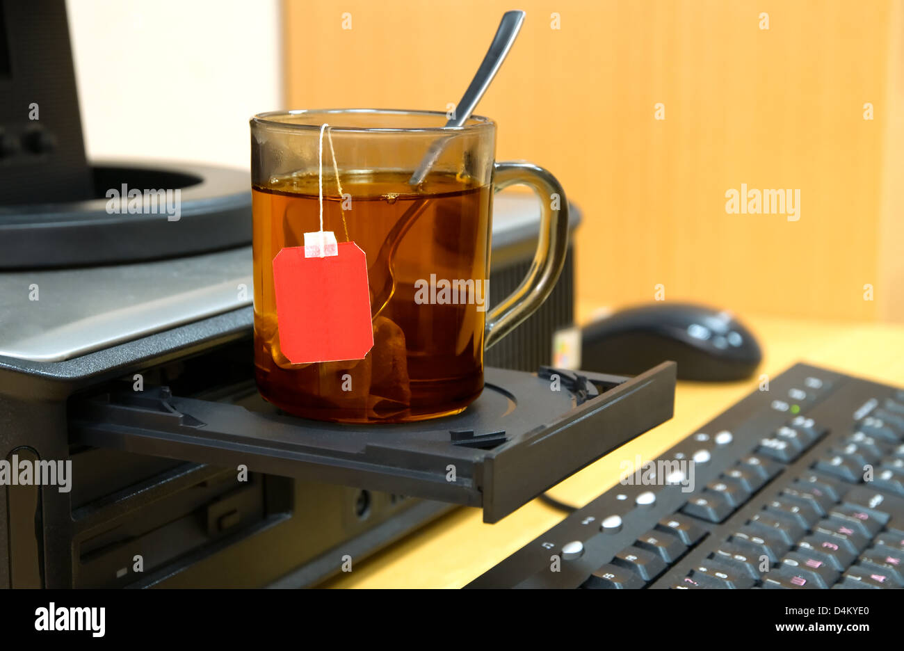The cup of tea stands on the disk drive of a computer Stock Photo - Alamy