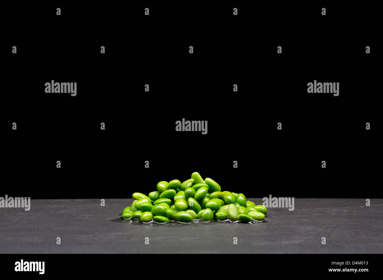 Pile of beans on counter Stock Photo - Alamy