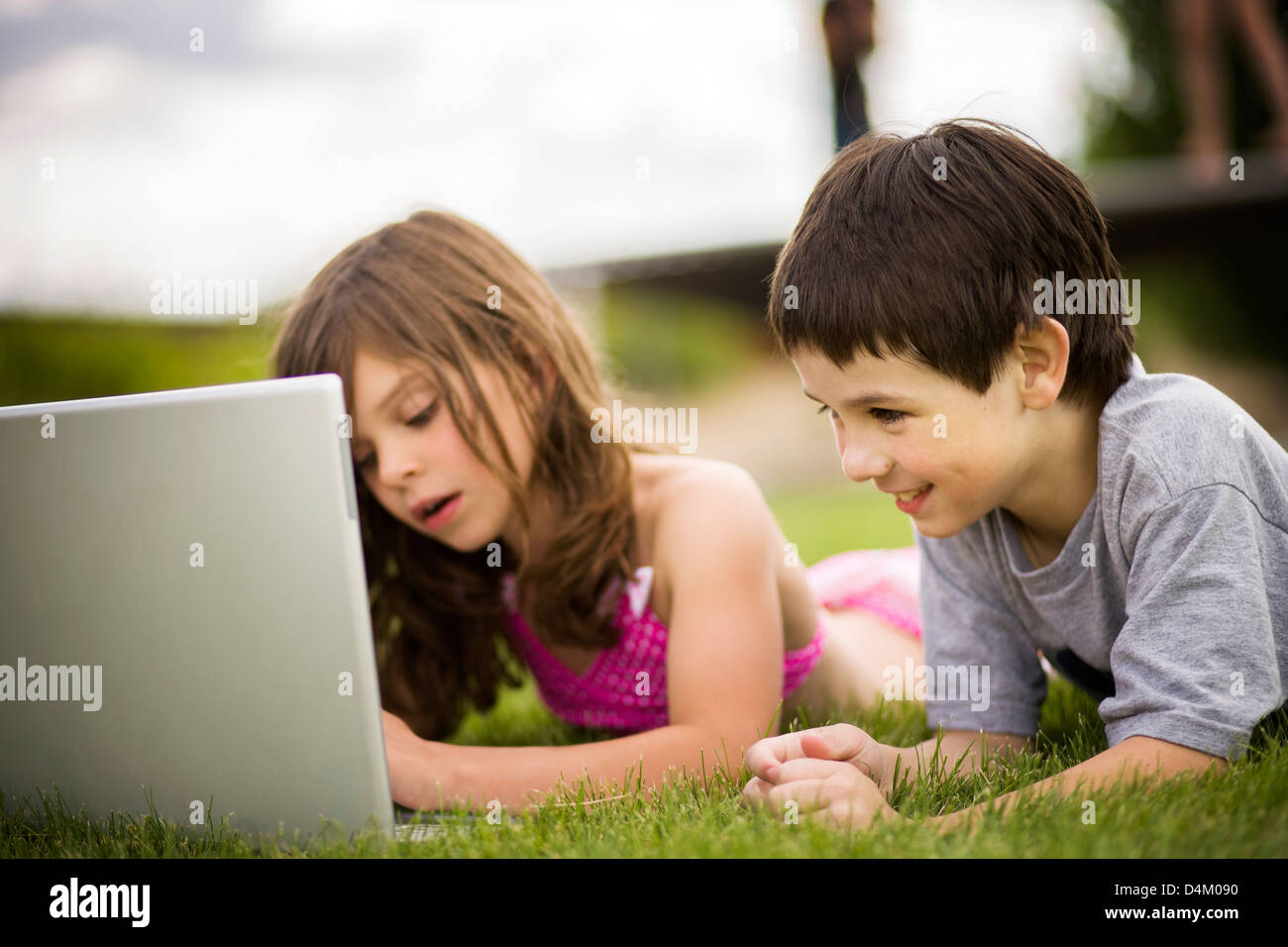 Children using laptop outdoors Stock Photo - Alamy