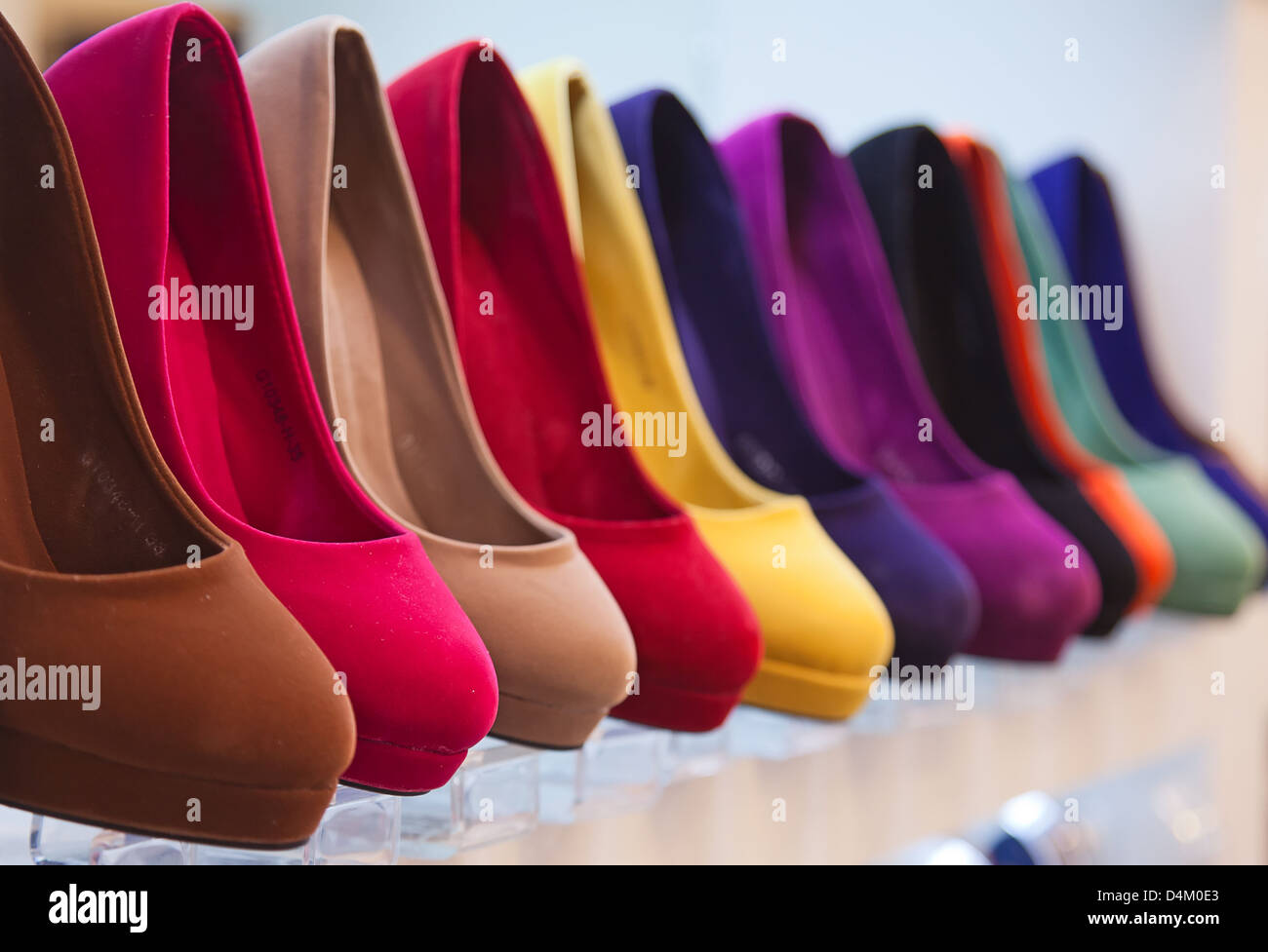 variety of the colorful leather shoes in the shop Stock Photo - Alamy