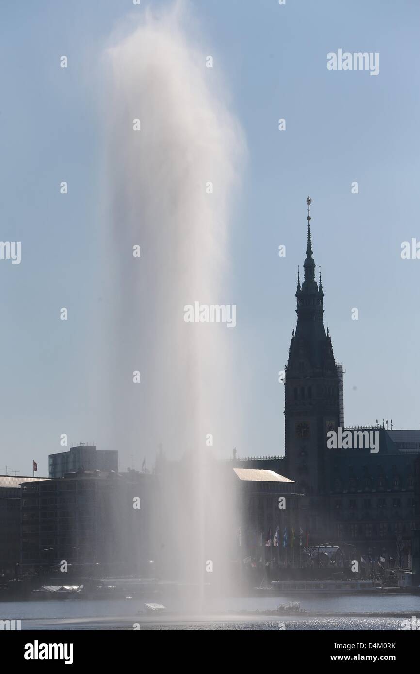 View of the Alster fountain on the inner Alster lake in front of the ...