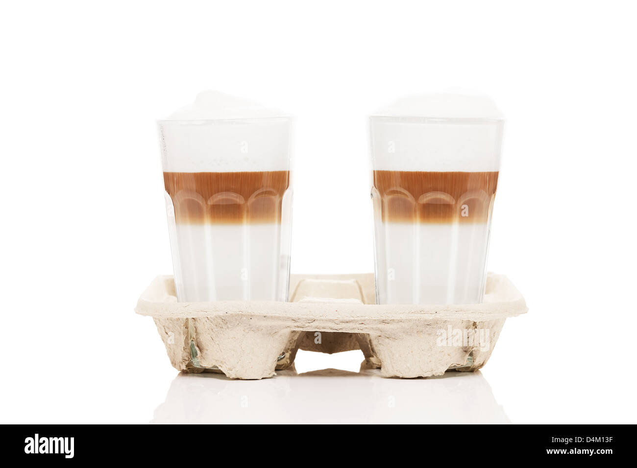 latte macchiato to go in cupholder on white background Stock Photo - Alamy