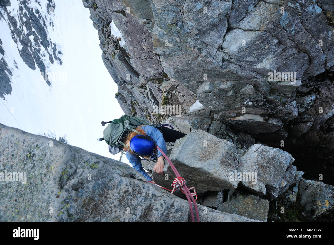 A woman climber has just climbed into Tower Gap on Tower Ridge, Ben ...