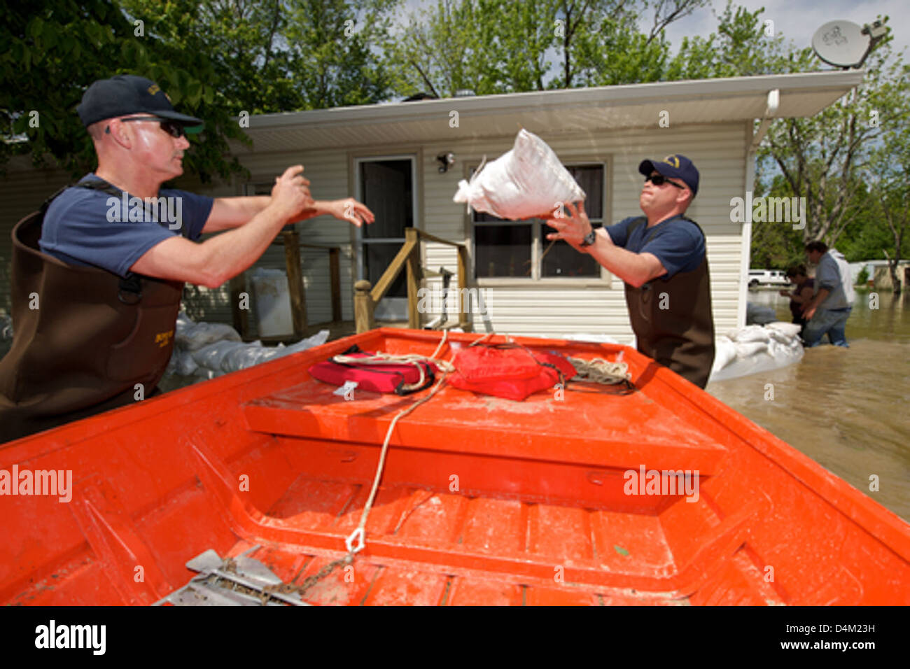 The U.S. Coast Guard and local agencies respond to flooding in the ...