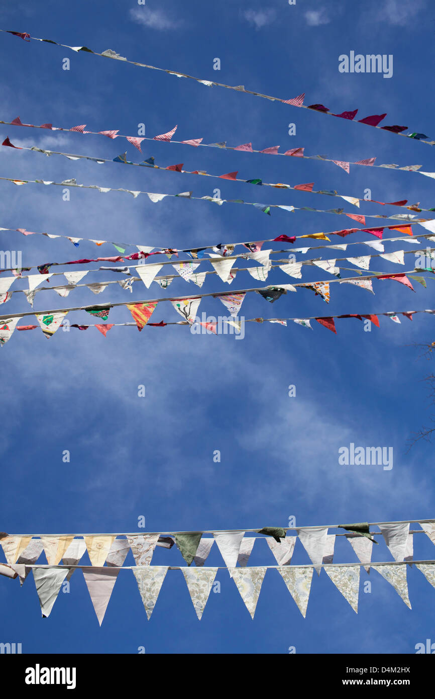 Flags flying against blue sky Stock Photo - Alamy