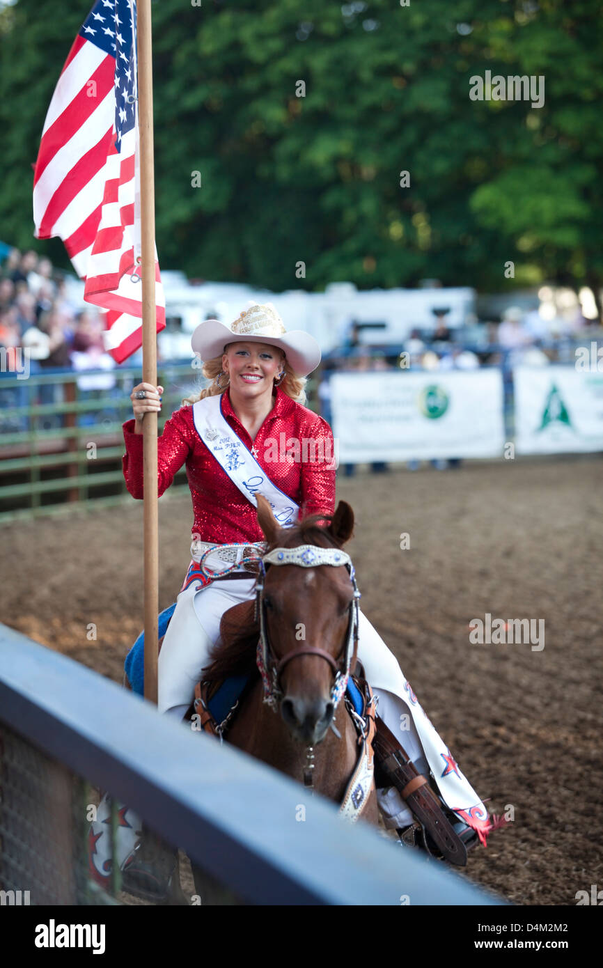 Picture of the rodeo queen riding with a flag. Small town Americana ...