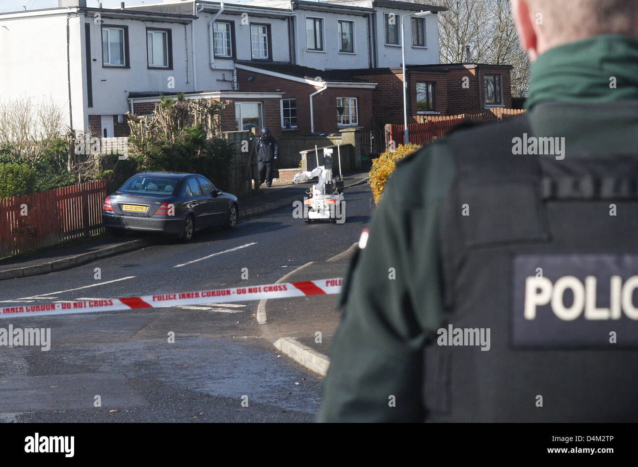 Armagh, Northern Ireland. 15th March 2013. Police officer looks on from ...