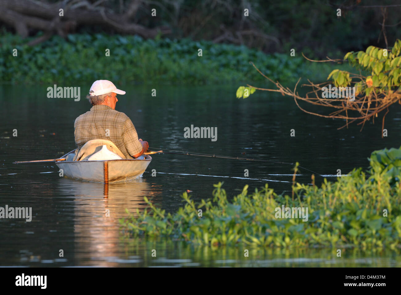 Fishing from canoe Stock Photo - Alamy