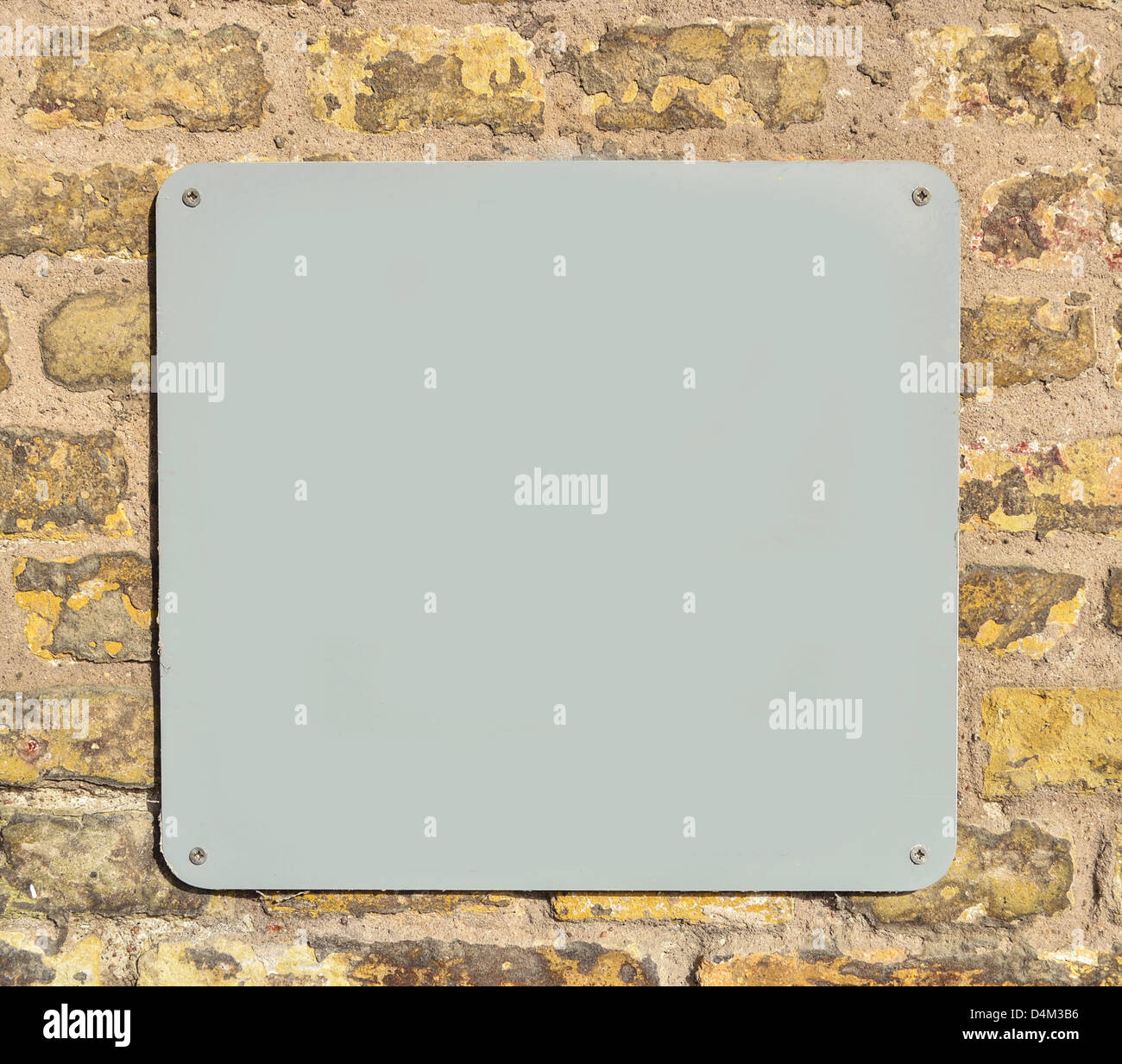 Empty metal plate on brick wall Stock Photo - Alamy