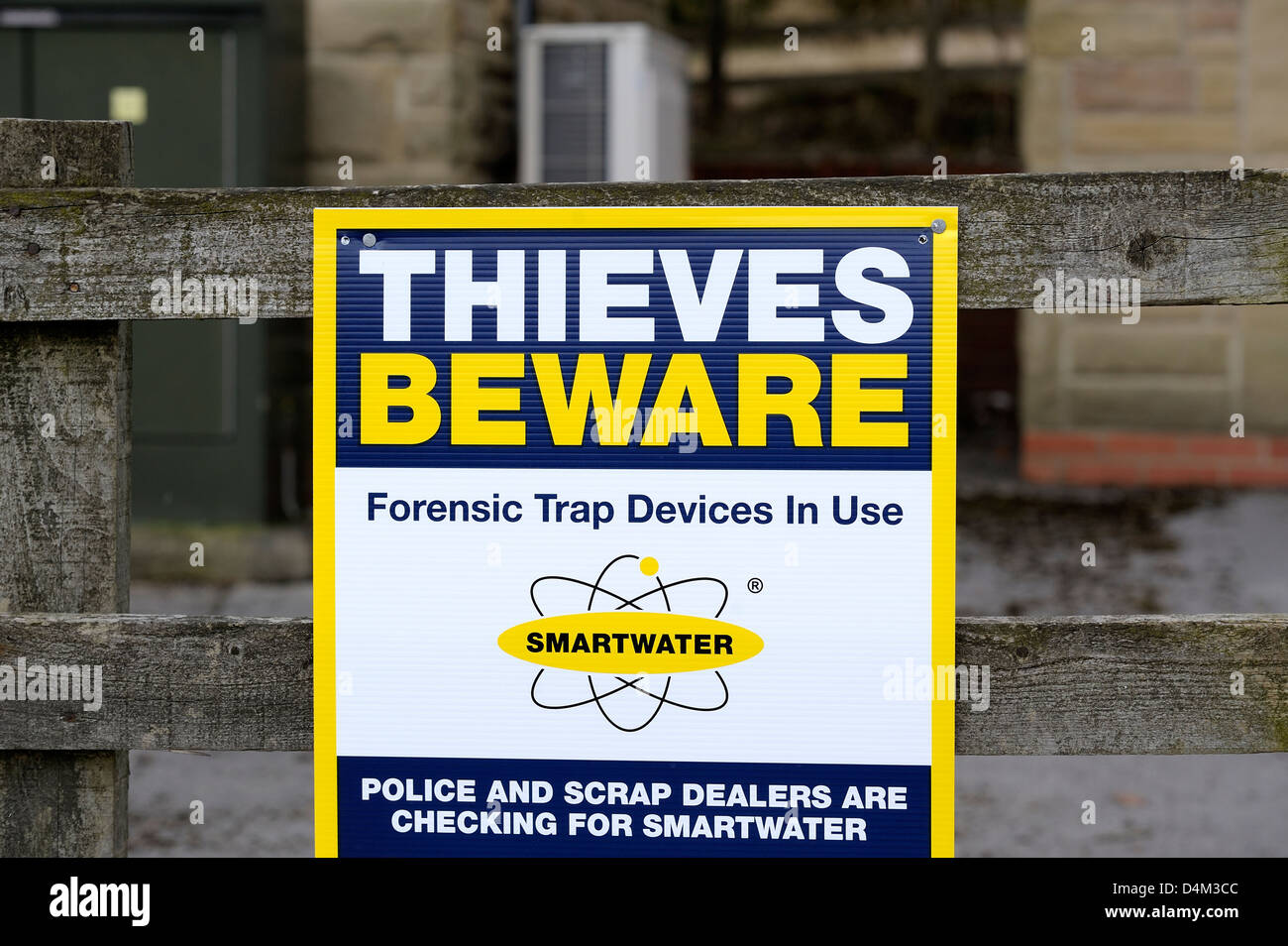 Thieves beware forensic trap devices in use sign Stock Photo - Alamy