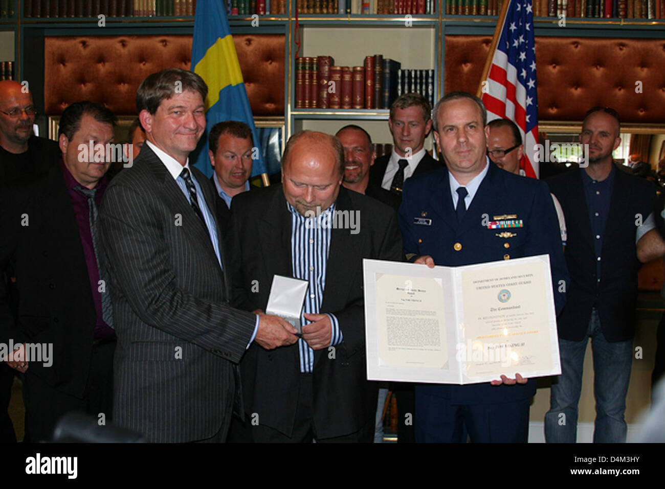 Captain Kenyon presented the crew of the tugboat Tor Viking II with the ...