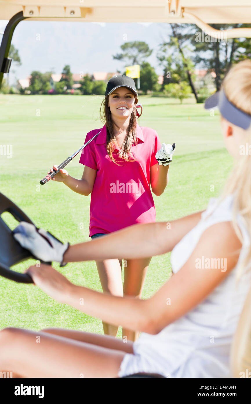 Women playing golf on course Stock Photo - Alamy