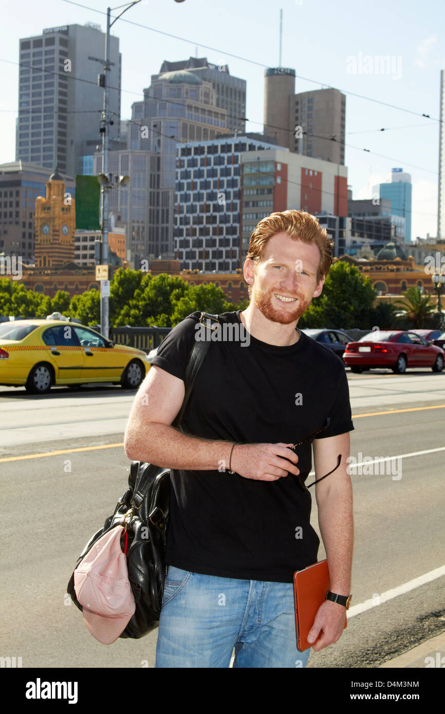 Man standing on city street Stock Photo - Alamy