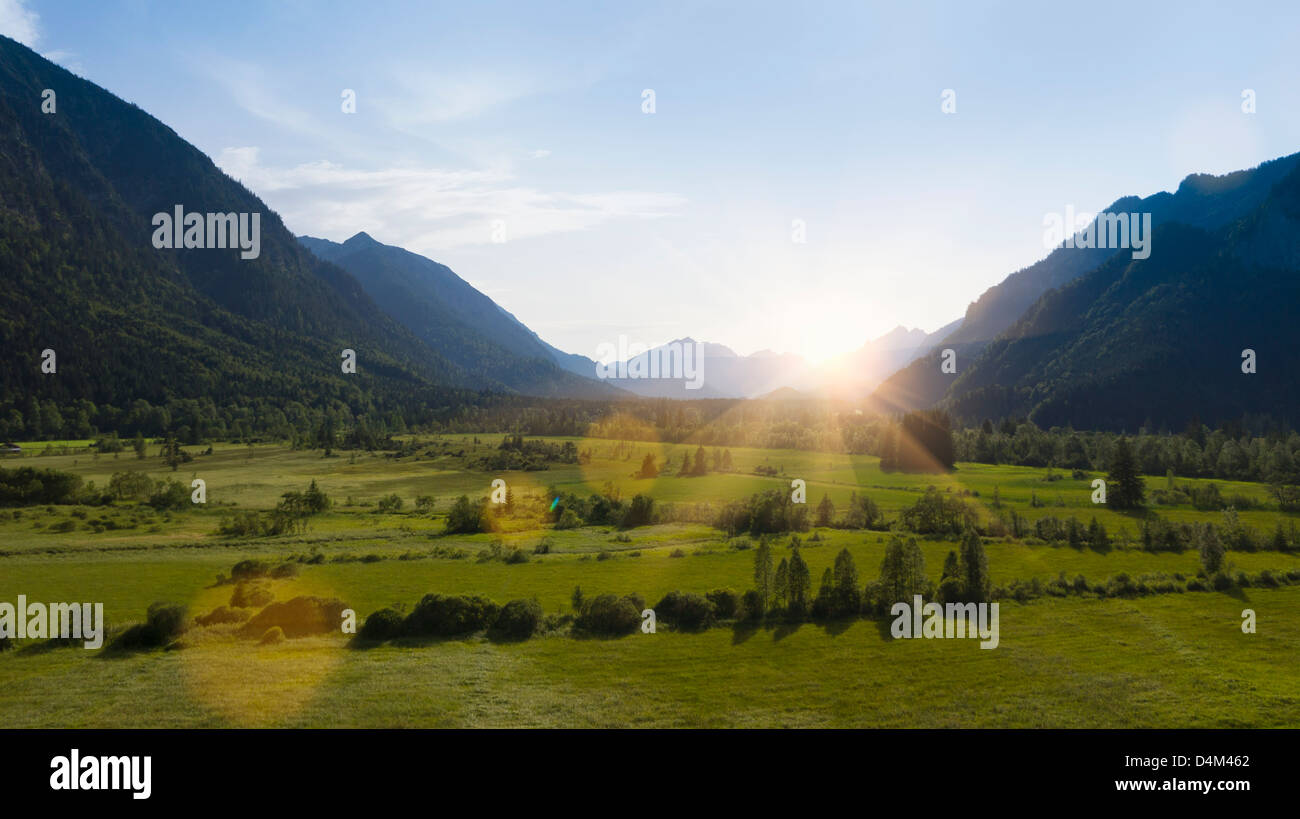 Sun shining over rural landscape Stock Photo - Alamy