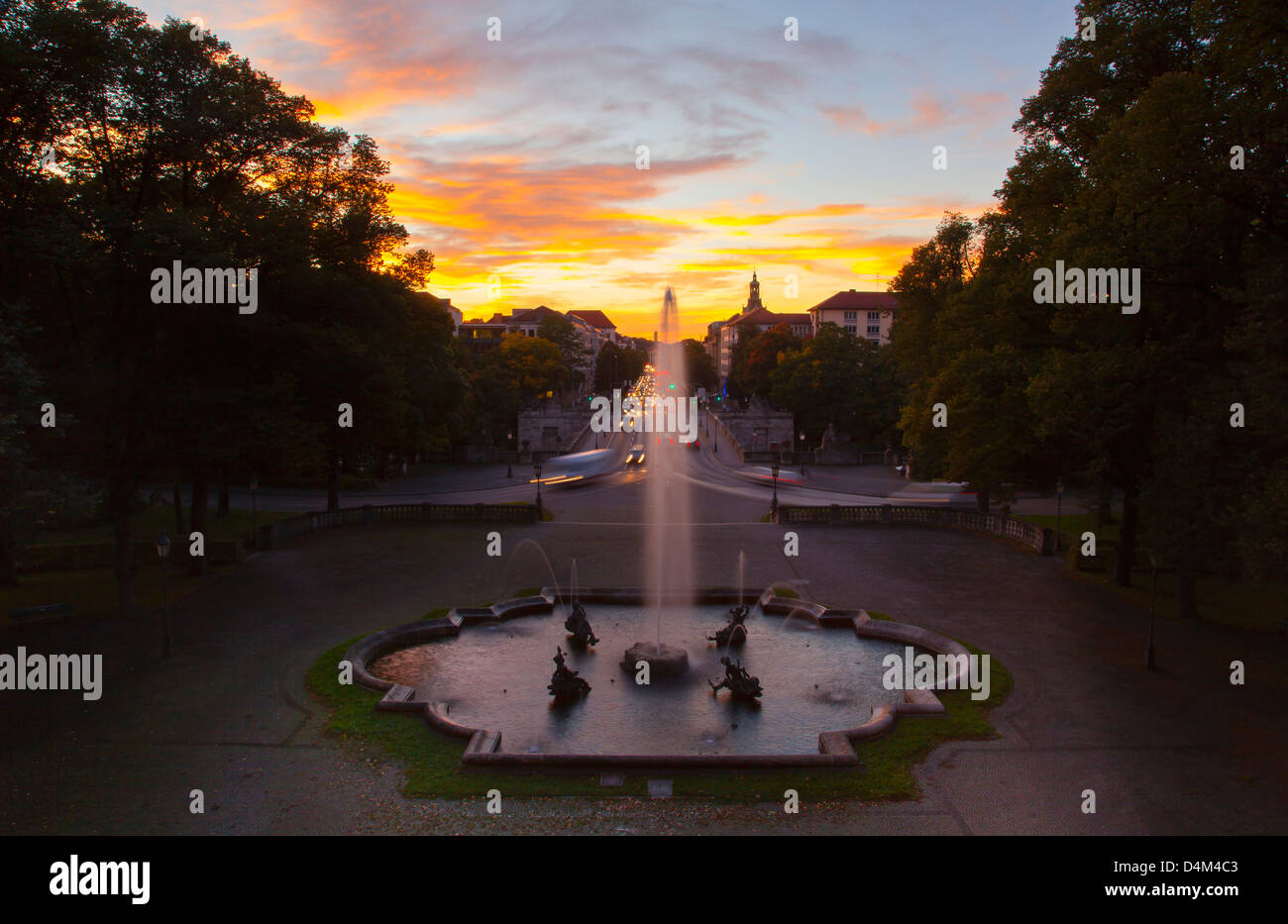 Ornate fountain in town square at dusk Stock Photo - Alamy