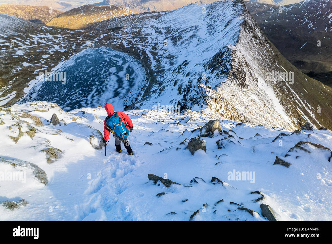 Striding edge winter walker snow hi-res stock photography and images ...