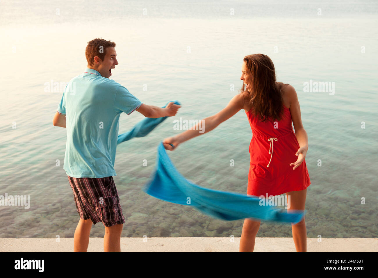 Couple snapping towels other hi-res stock photography and images - Alamy