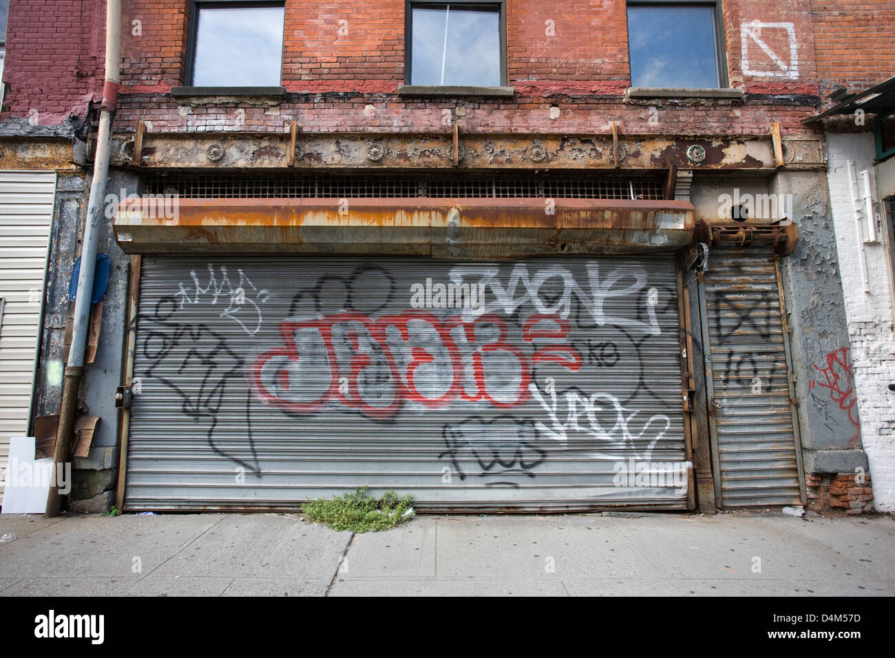 Derelict and empty shops in the street under the Brooklyn Bridge in New ...