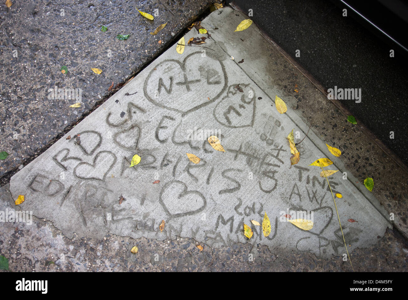 Patch of concrete with writing in the street, New York Stock Photo - Alamy