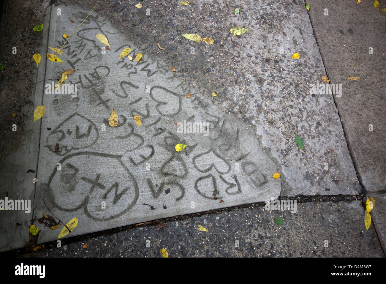Patch of concrete with writing in the street, New York Stock Photo - Alamy