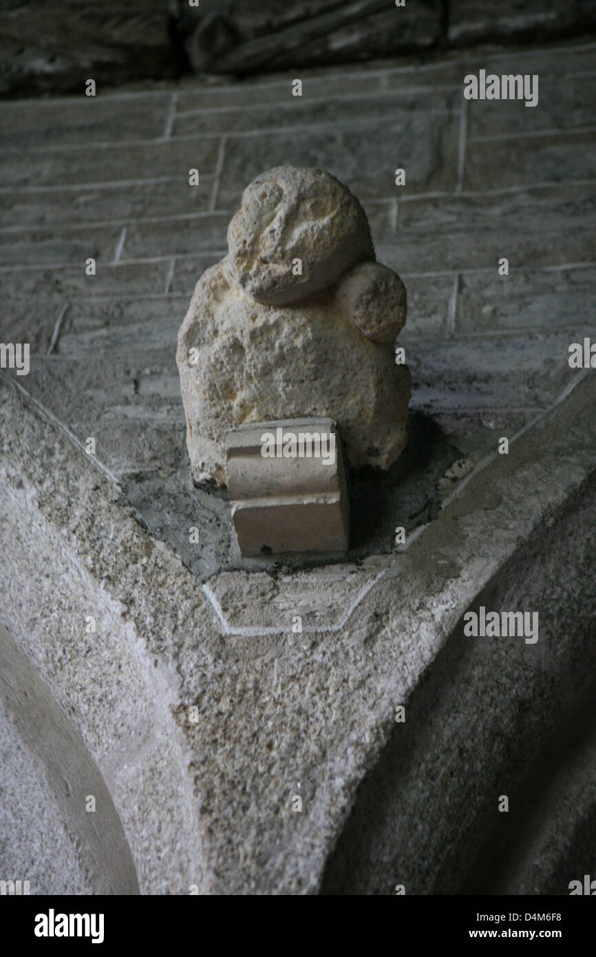 A carved head on a corbel above the first pillar in ST Tudy church ...