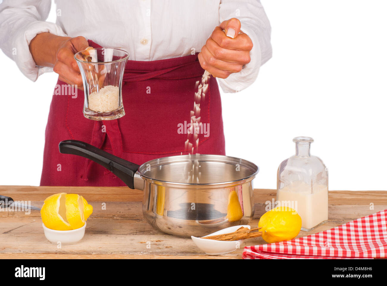 Adding rice to a pot, preparing traditional rice pudding Stock Photo ...