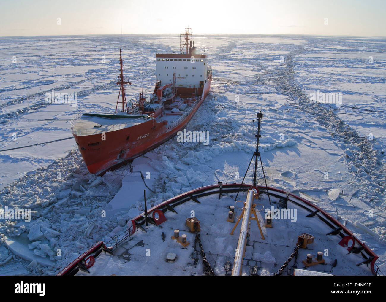 The Coast Guard Cutter Healy provides icebreaking assistance to the ...