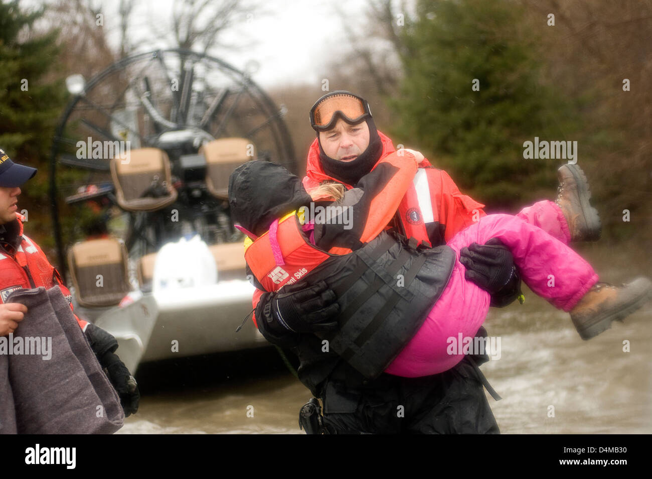 Carrying to Safety Stock Photo - Alamy