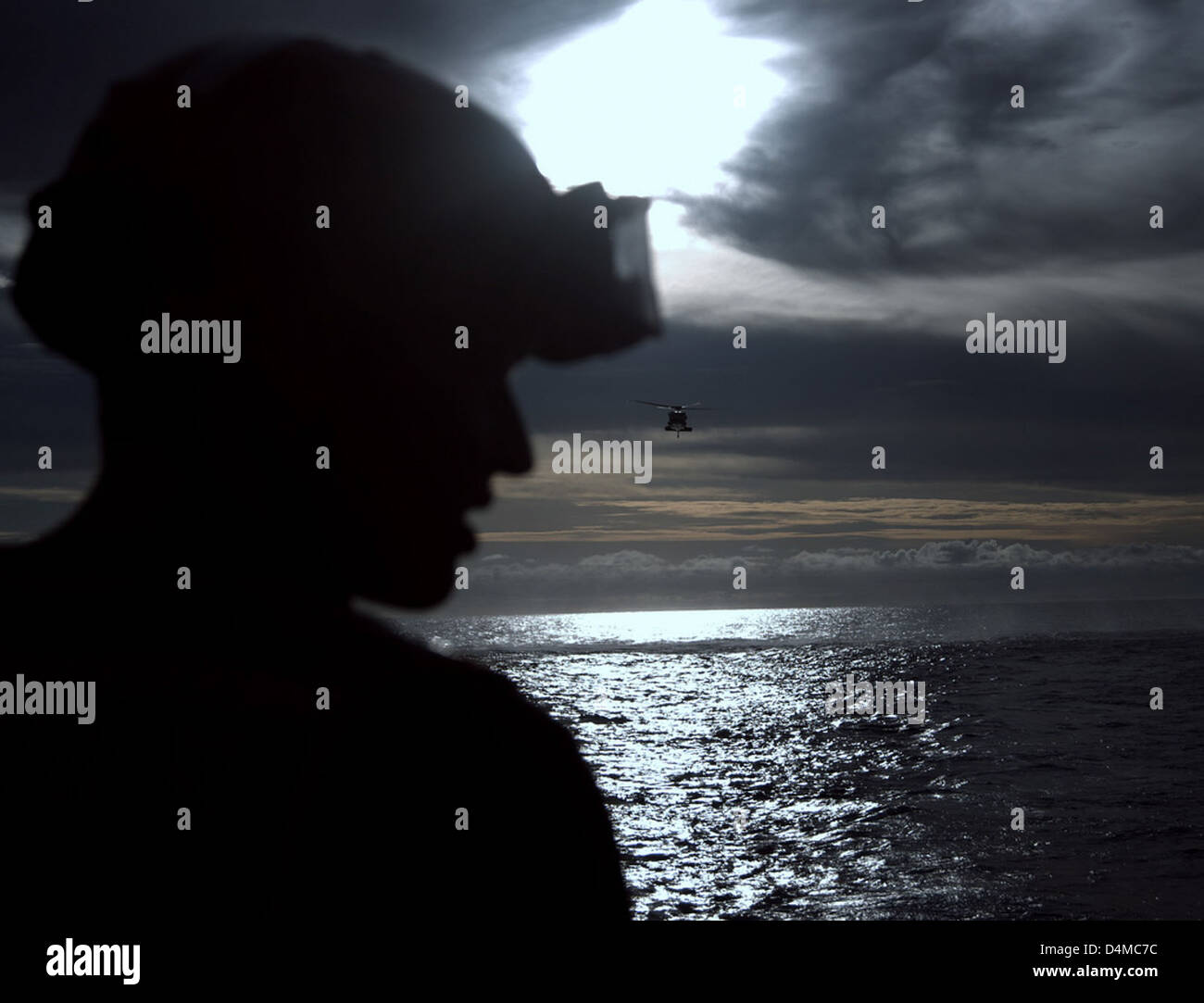 This image captures a Coast Guard crew conducting a night mission ...