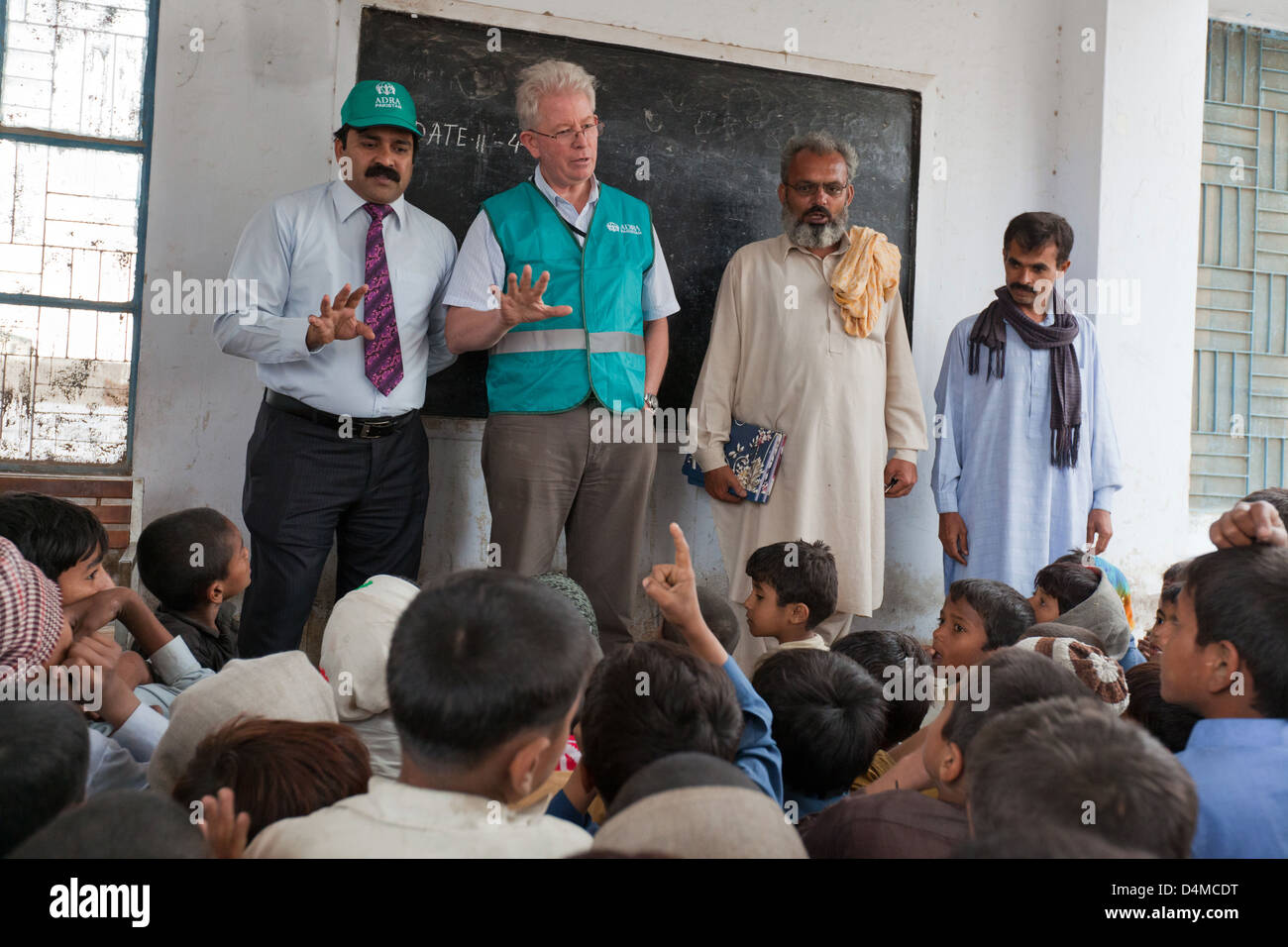 Chabakpur, Pakistan, Men of the aid organization ADRA in a village ...