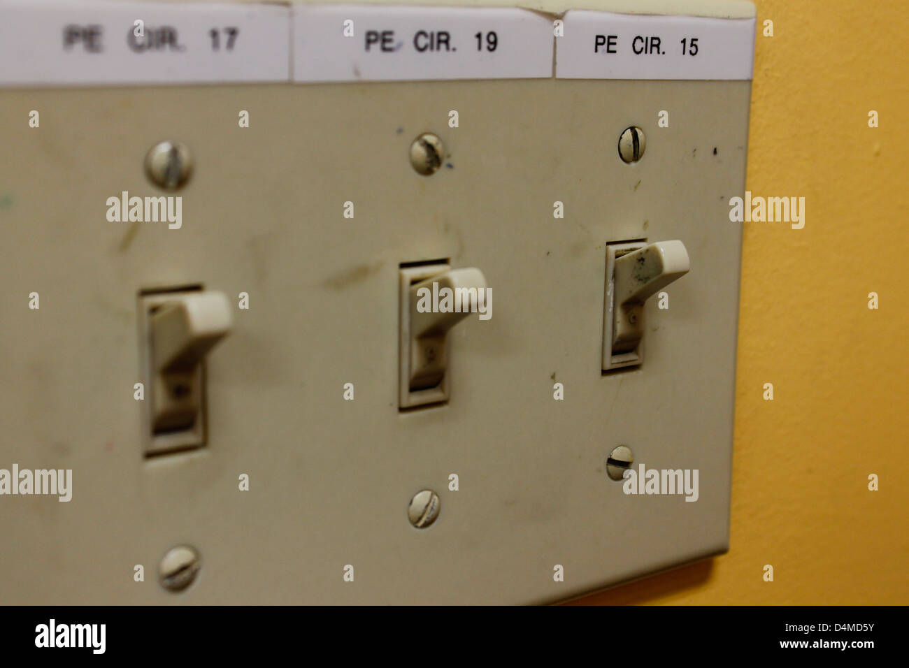 light switches close up with yellow wall Stock Photo - Alamy