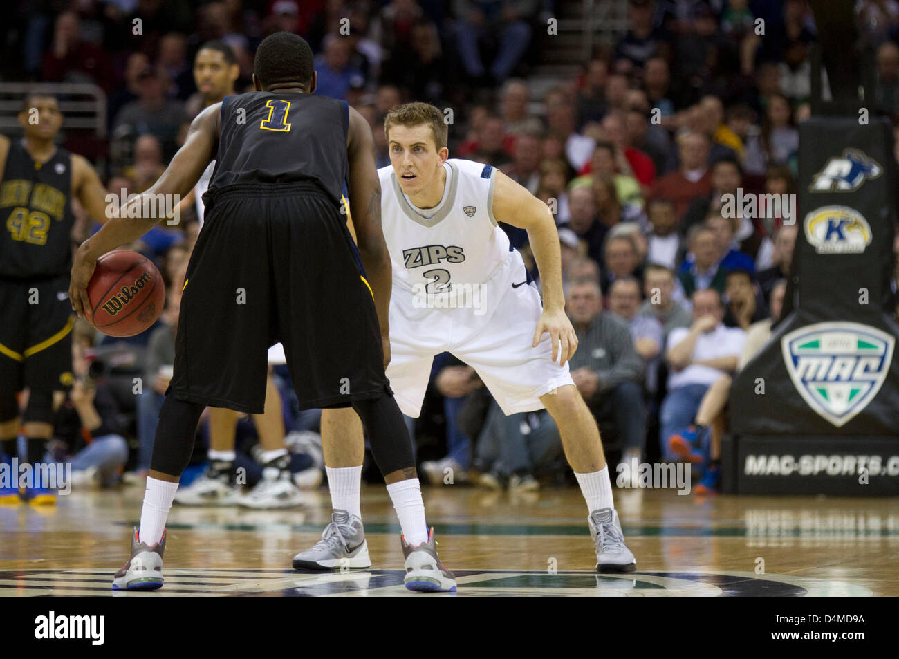 March 15, 2013: Kris Brewer (1) of Kent State is defended by Brian ...