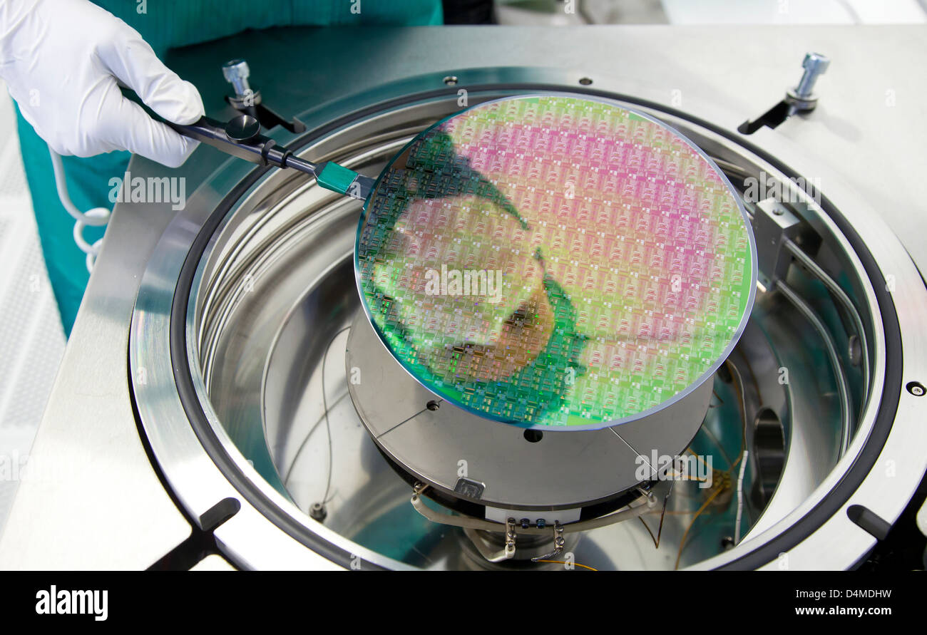 Duisburg, Germany, a micro technologist working in the clean room at ...