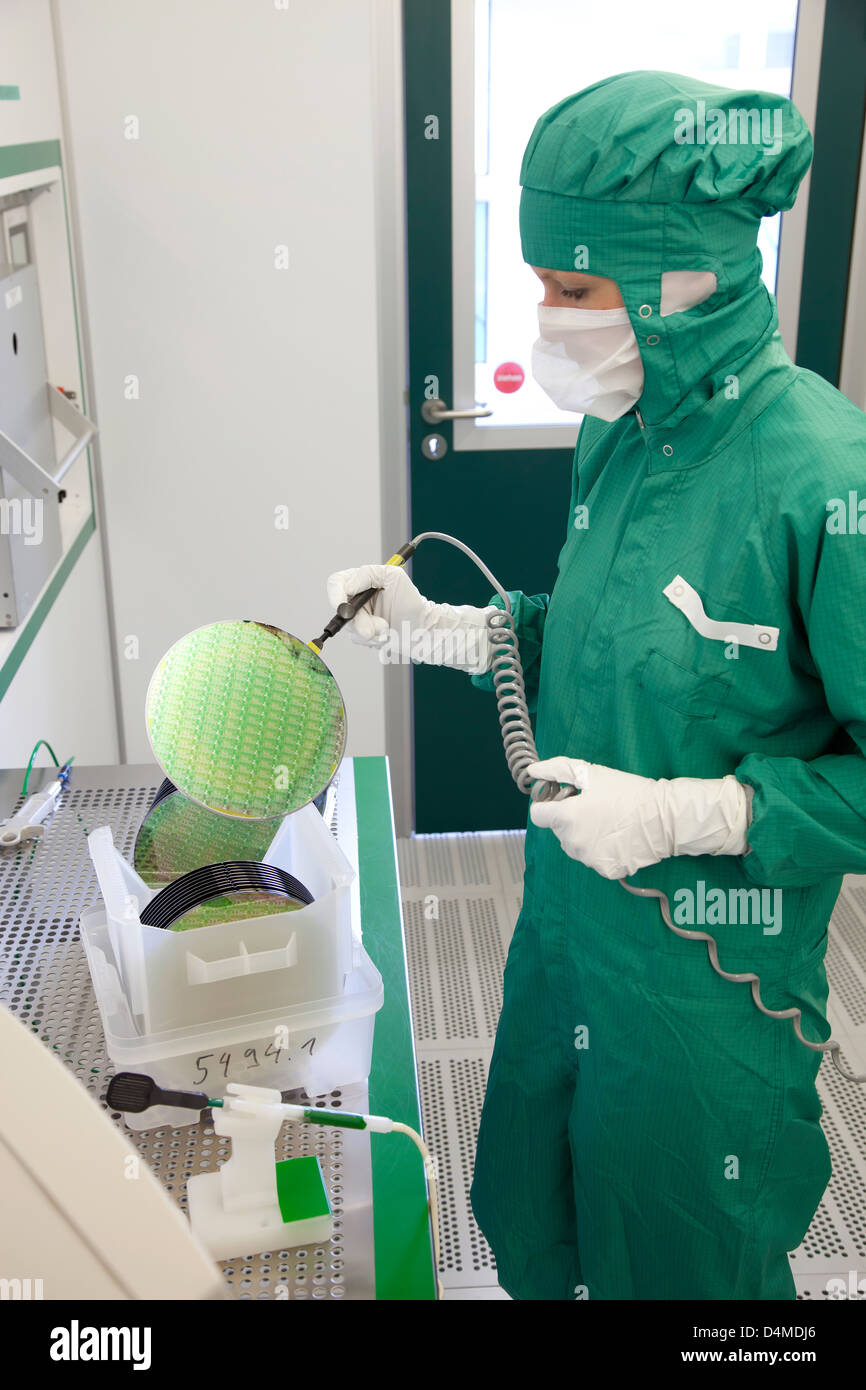 Duisburg, Germany, a micro technologist working in the clean room at ...