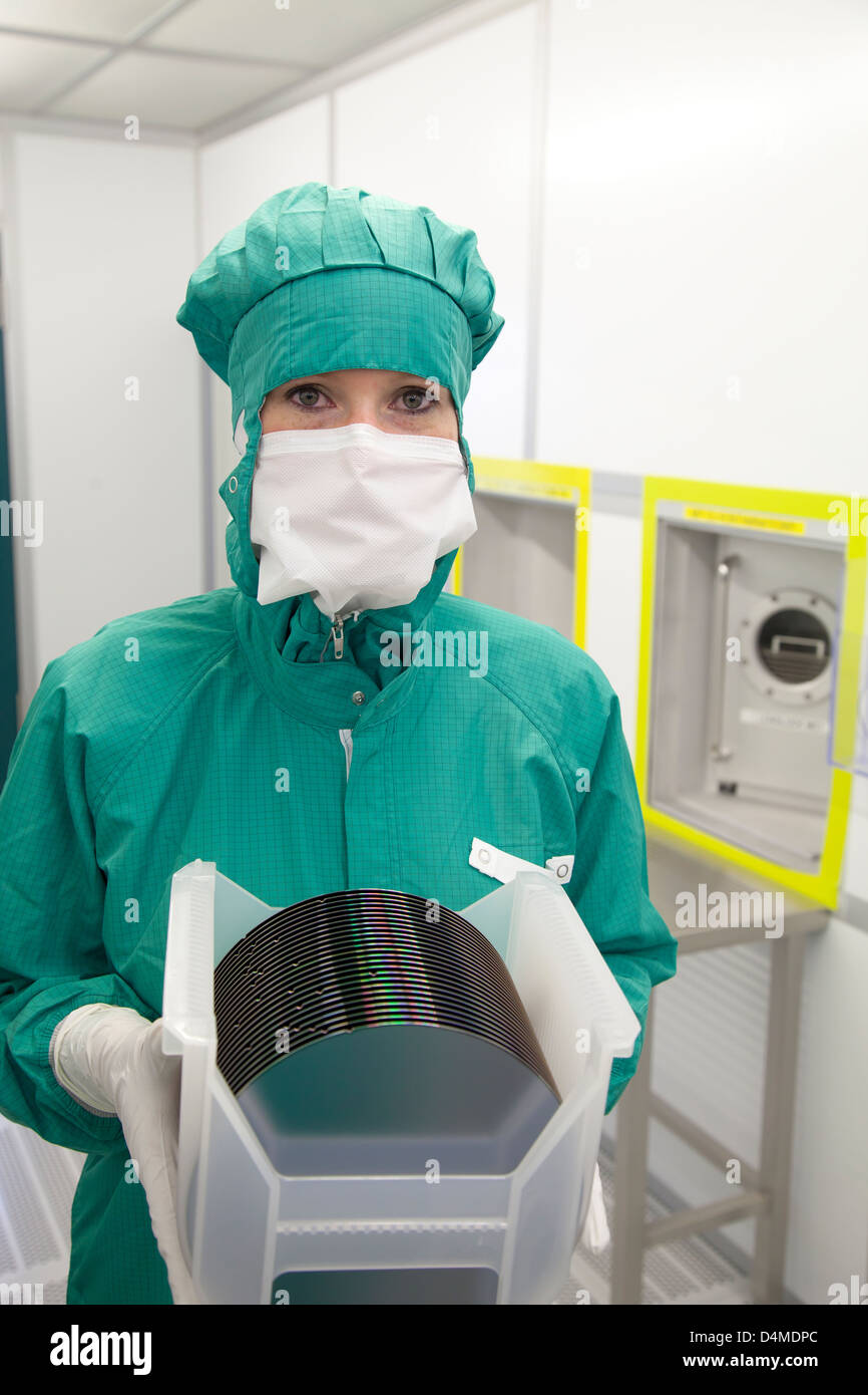 Duisburg, Germany, a micro technologist working in the clean room at ...