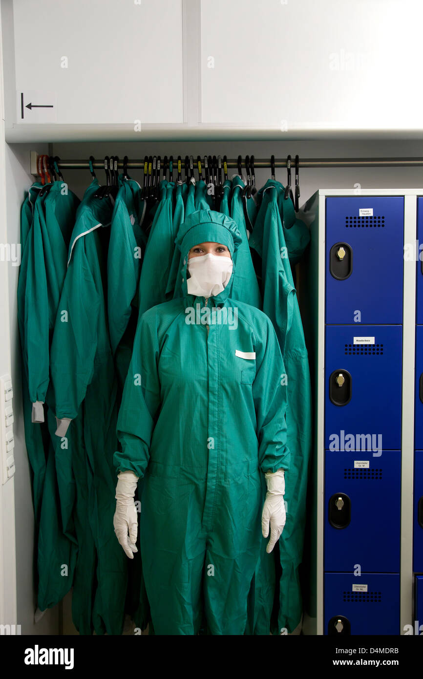 Duisburg, Germany, a micro technologist working in the clean room at ...
