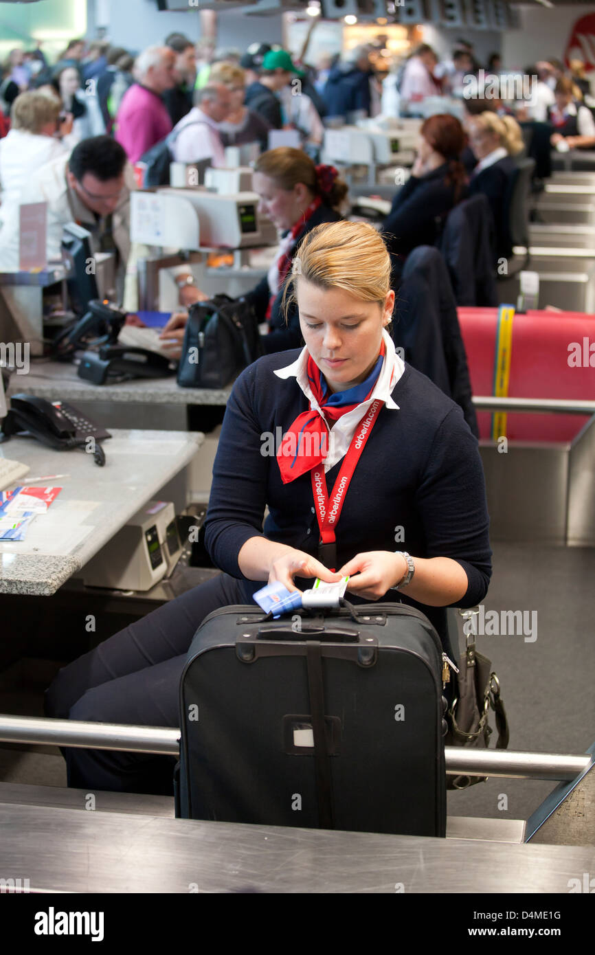 Duesseldorf, Germany, ground staff at airberlin check-in desk at the ...