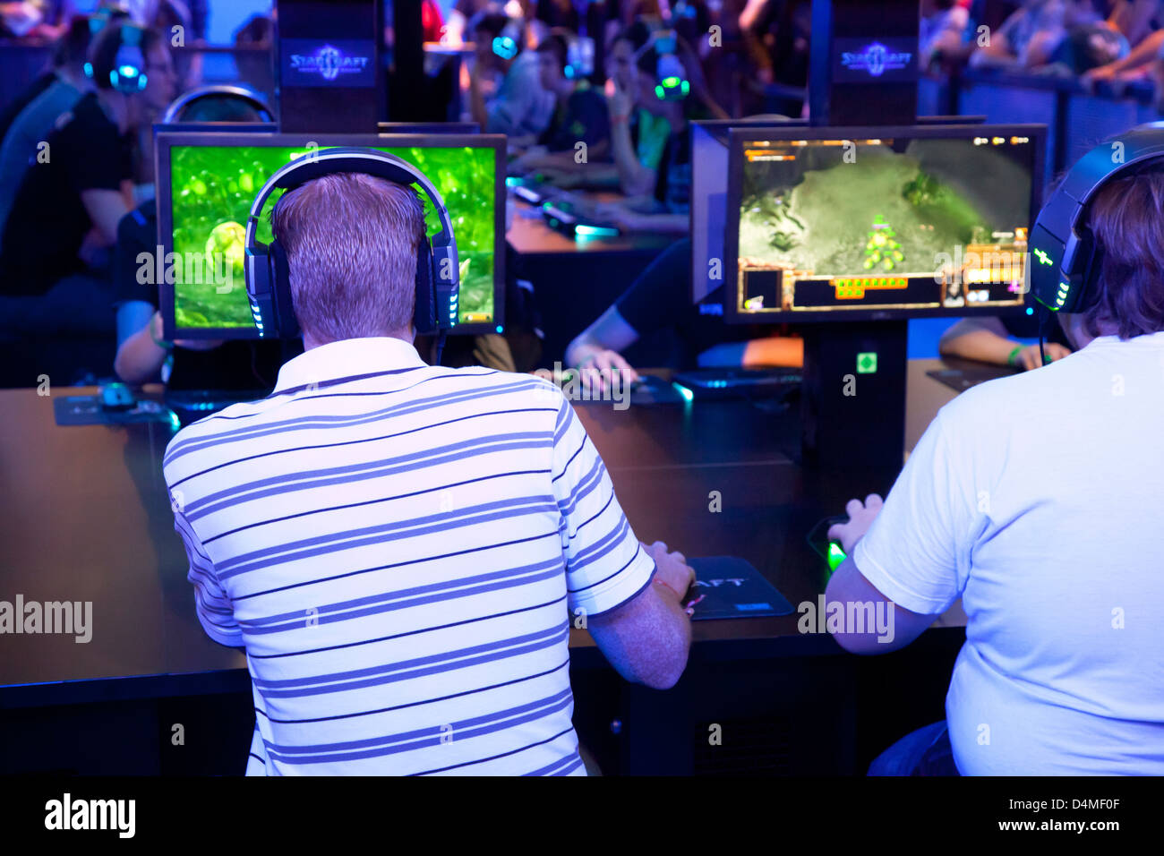 Koeln, Germany, young people playing computer games at the fair ...