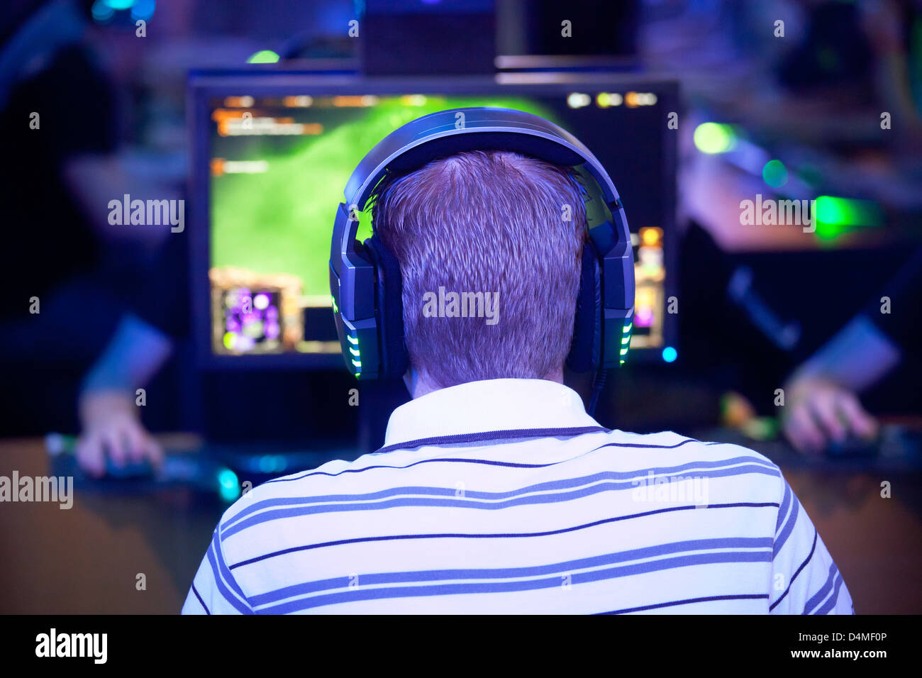 Koeln, Germany, young people playing computer games at the fair ...